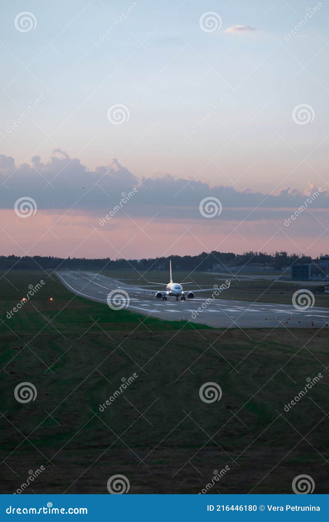 Plane on runway on sunset stock photo. Image of airplane - 216446180