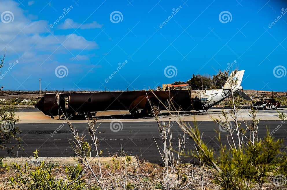 A Plane is Sitting on the Ground with Its Wing Missing Stock Photo ...