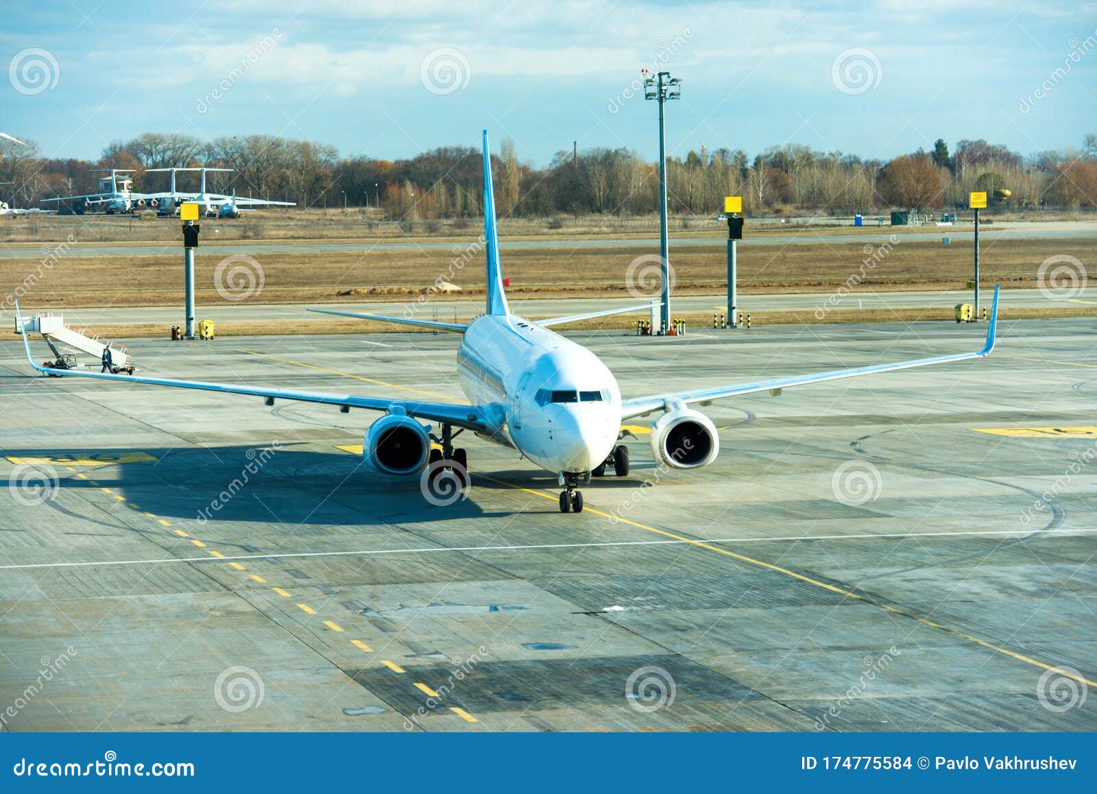 Plane standing on runway stock photo. Image of runway - 174775584