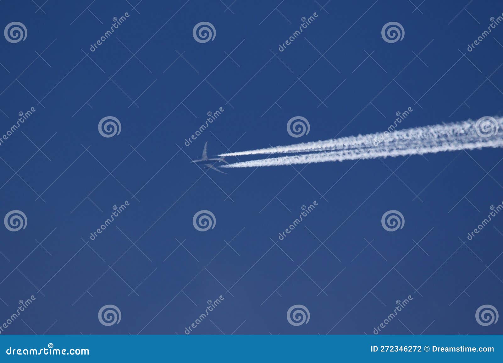 A Plane and Vapor Trails in the Sky Stock Photo - Image of beam, plane ...