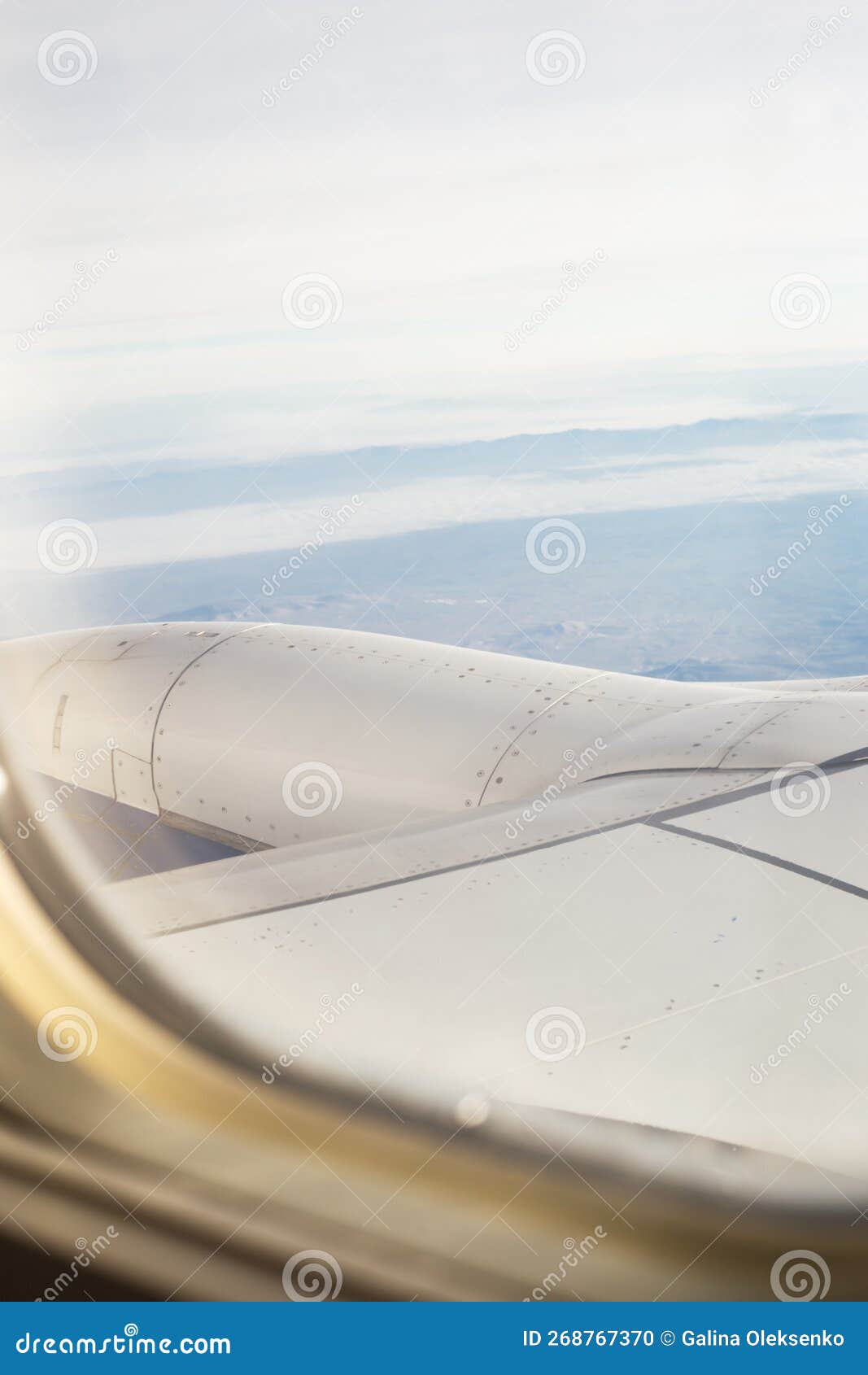 Plane Window View on Blue Sky, Clouds, Mountains. Scenes from an ...
