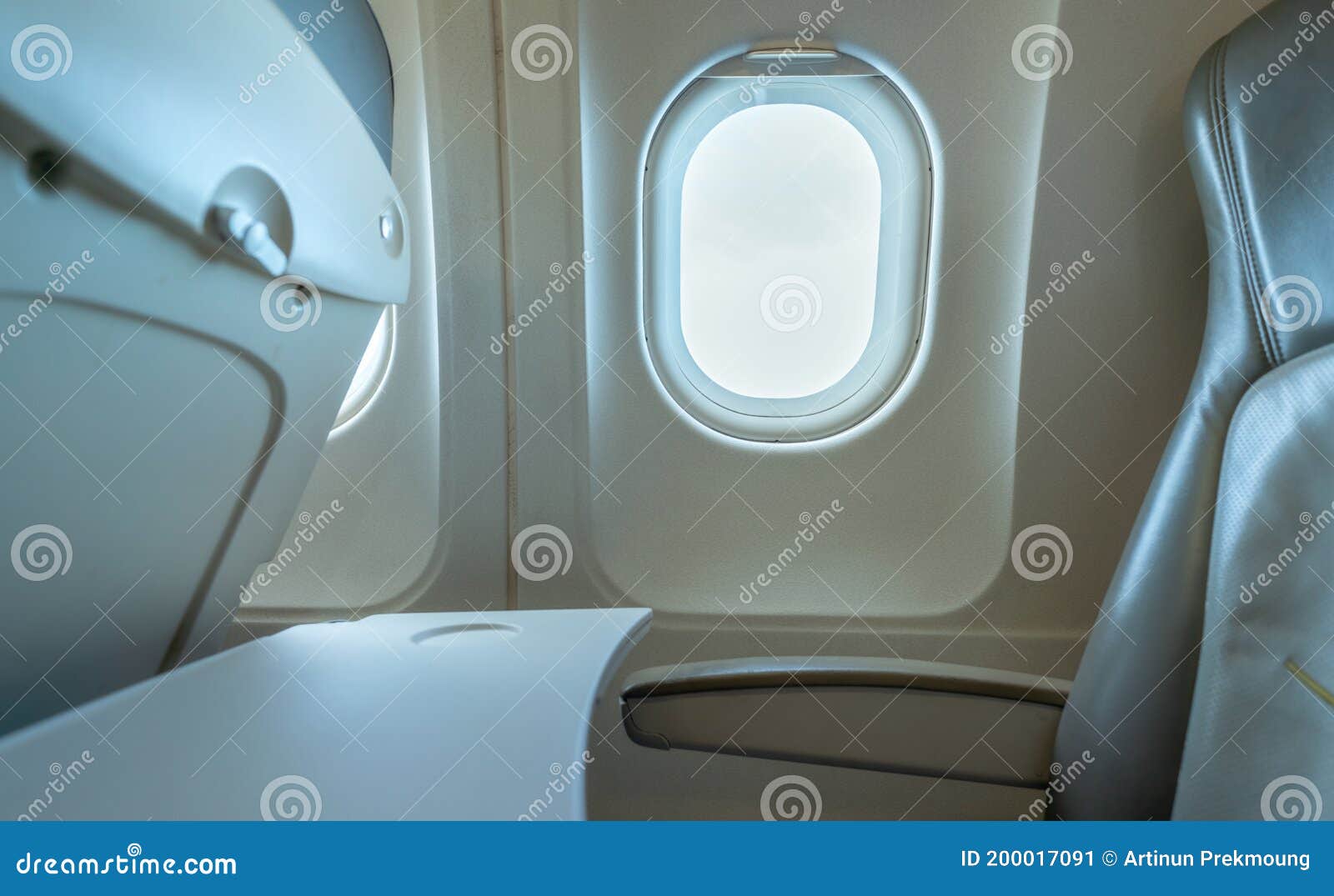 Plane Window with White Sunlight. Empty Plastic Airplane Tray Table at ...