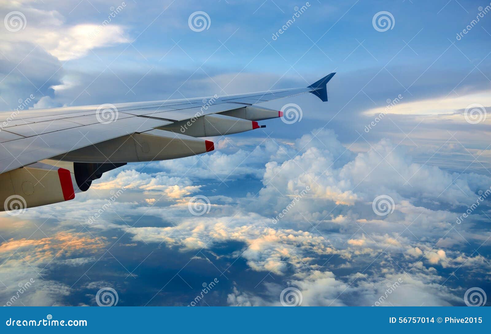 Plane wing over clouds stock photo. Image of flight, plane - 56757014
