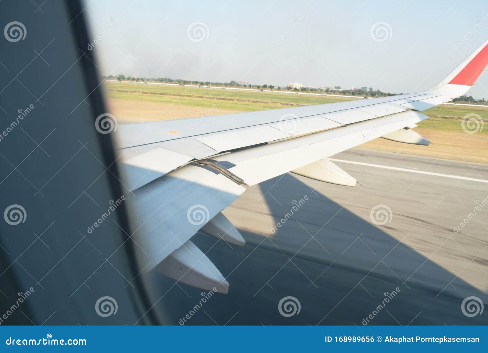 Plane Wing while Take Off from Airport Runway through Window Frame ...
