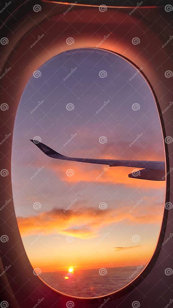 Plane Wing through the Window in a Sunset Editorial Stock Photo - Image ...