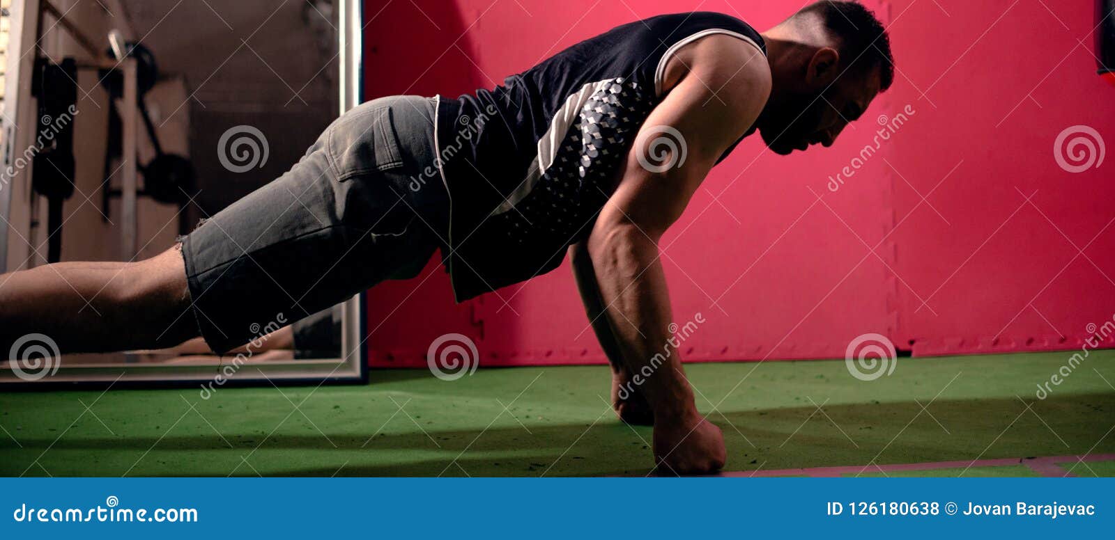 Muscular Young Man in Plank Position Stock Photo - Image of clothing ...