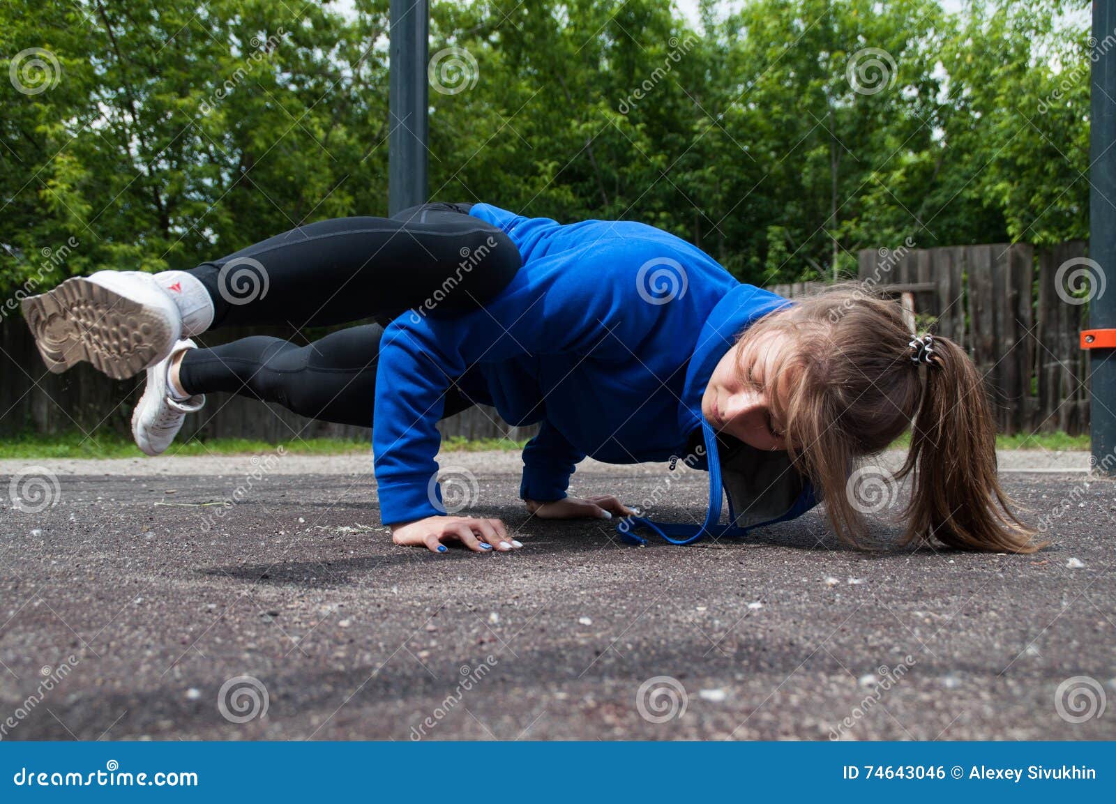 Plank on asphalt stock photo. Image of workout, hair - 74643046