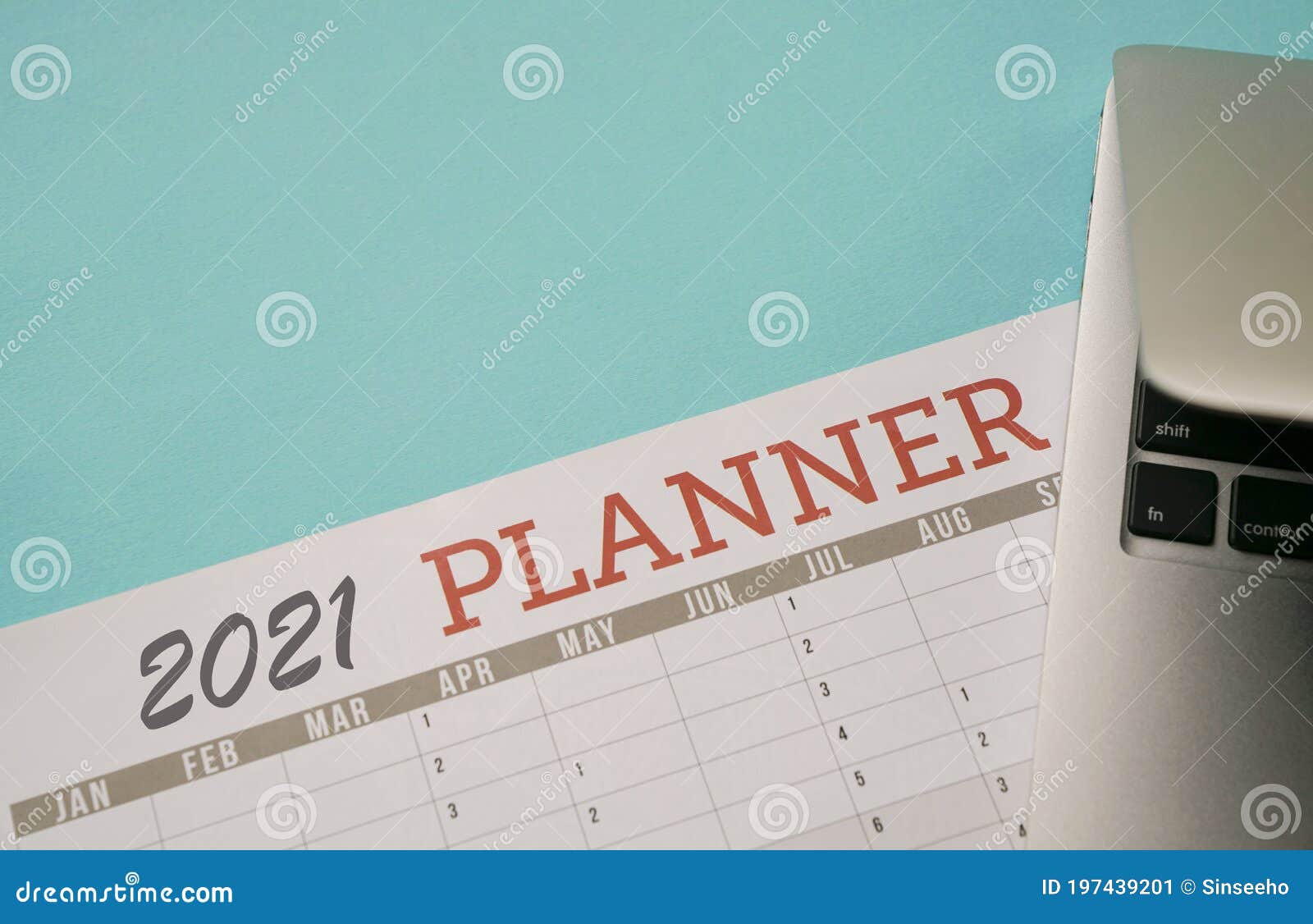 2021 Planner with Computer Laptop on Blue Tabletop Stock Image - Image ...