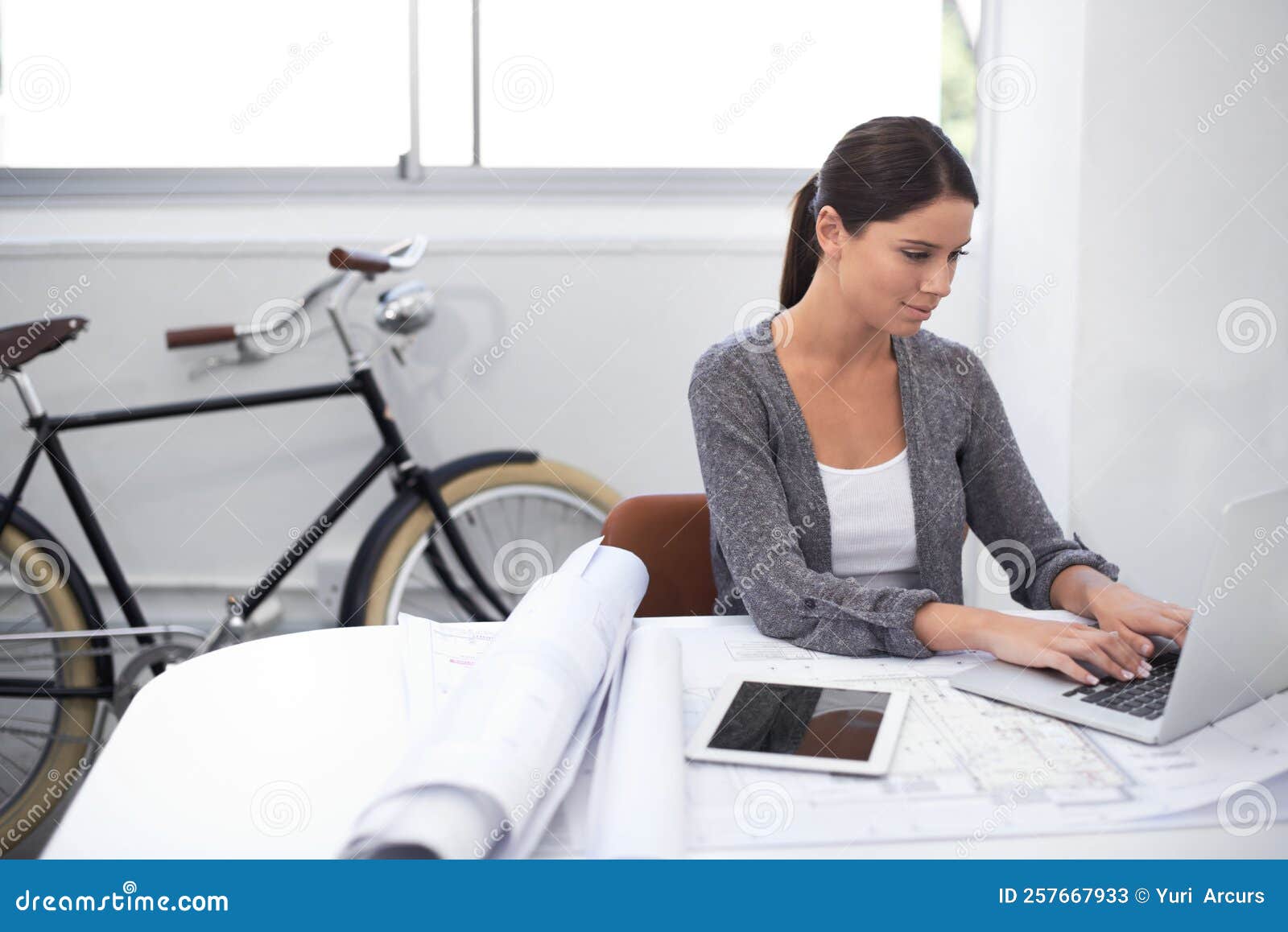 Planning Her Next Project. Attractive Young Architect Working at Her ...