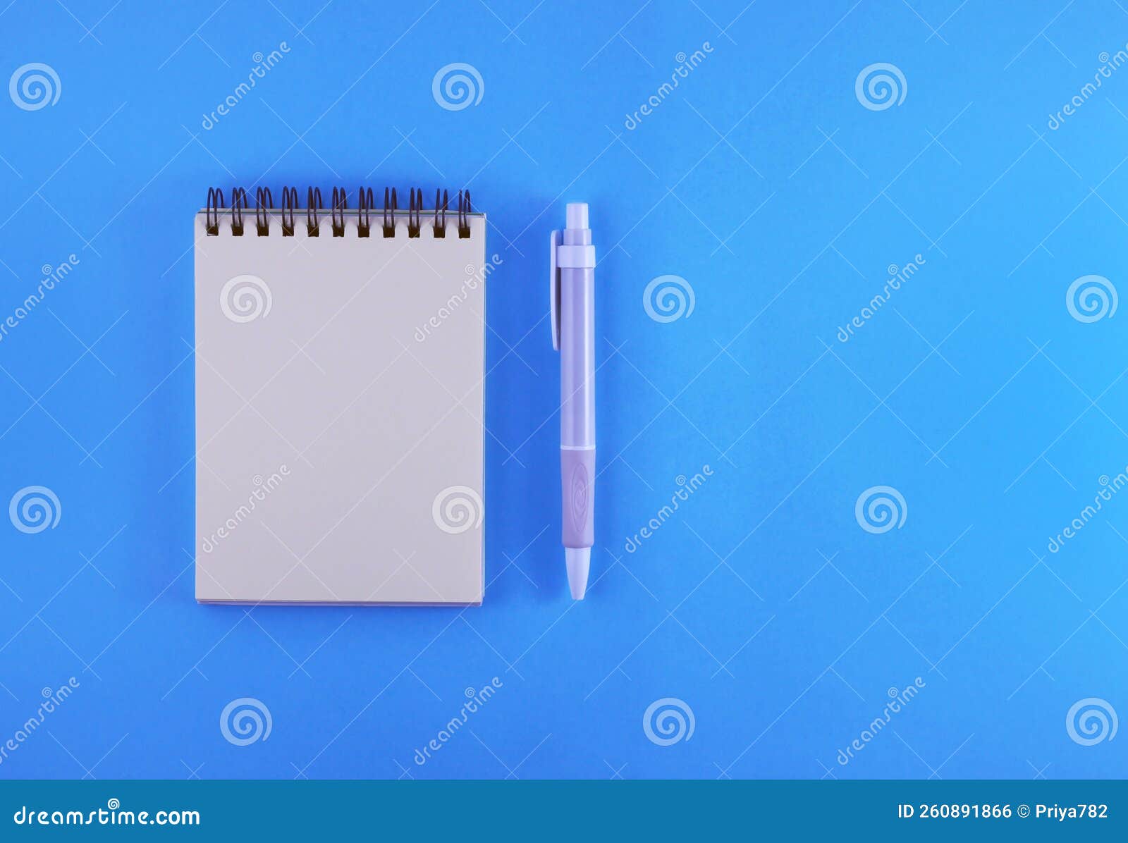 Blank Notepad and Pen on a Blue Background. View from Above. Stock ...