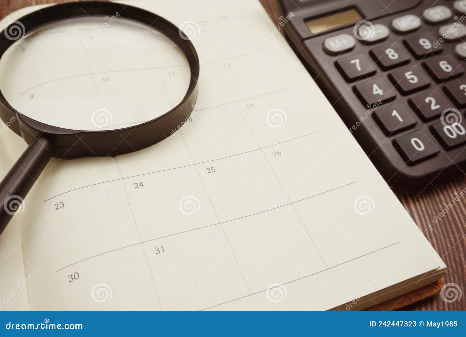 Planning Schedule with Magnifying Glass and Calculator on Wooden ...