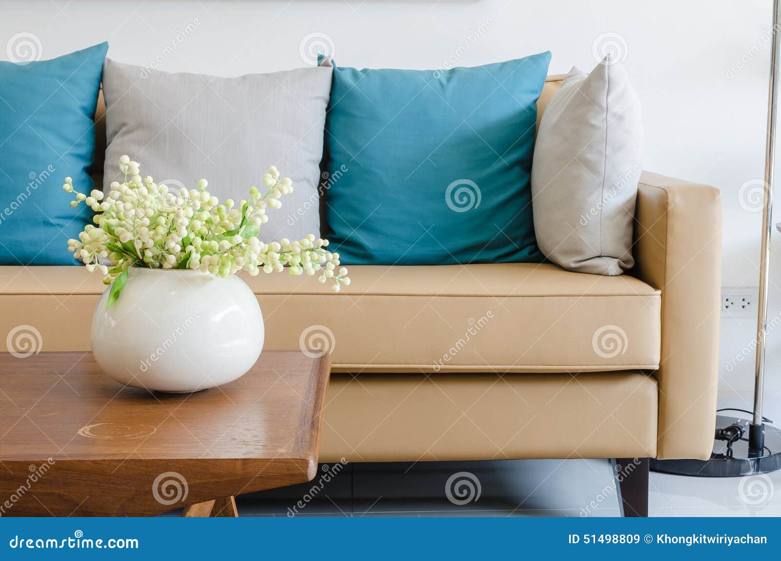 Plant in Ceramic Vase on Wooden Table with Modern Sofa Stock Image ...