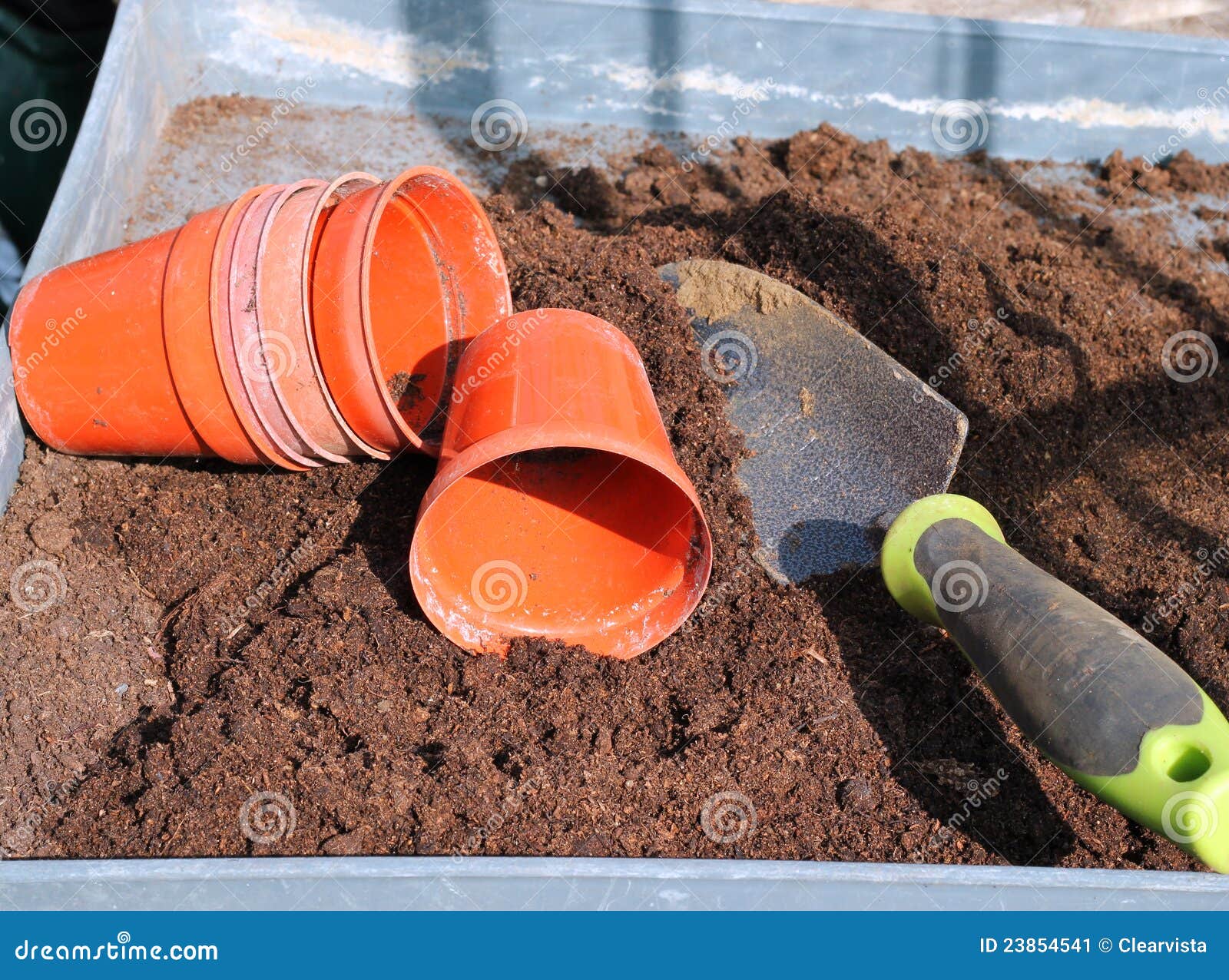 Plant Pots and Trowel in Compost. Stock Image - Image of growing ...