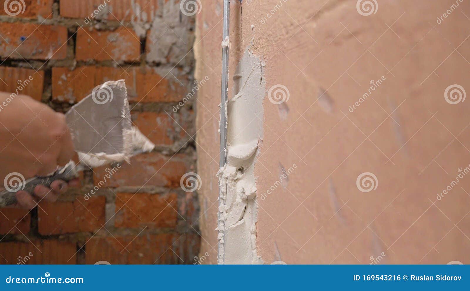 Decorative Plaster Coating. Man Does Ragged Texture on the Wall Using a ...