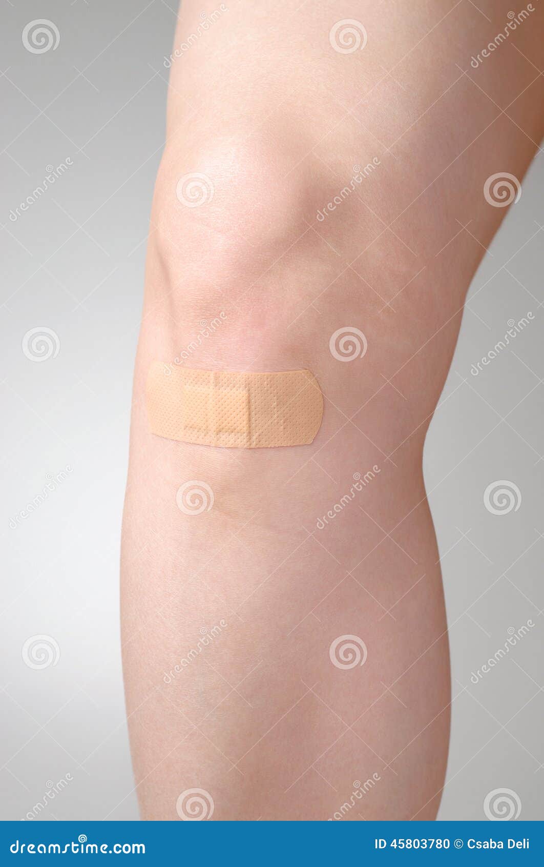 Plaster on female leg stock photo. Image of background - 45803780