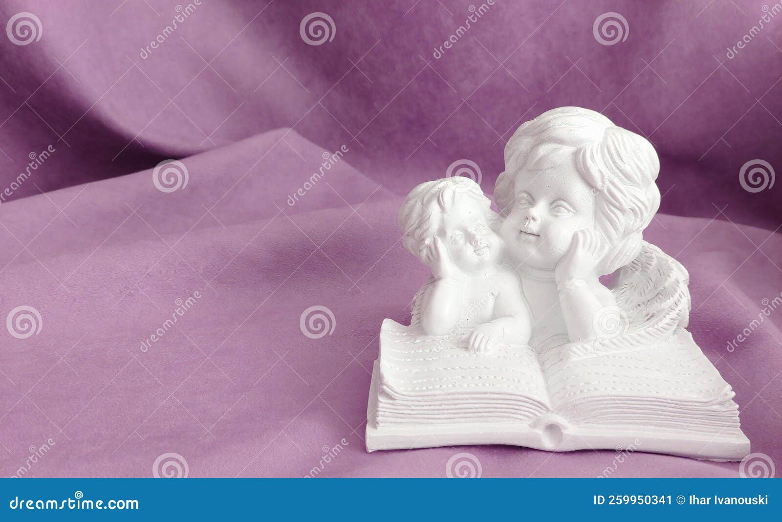 Plaster Statuette of Two Angels Reading a Book Stock Image - Image of ...