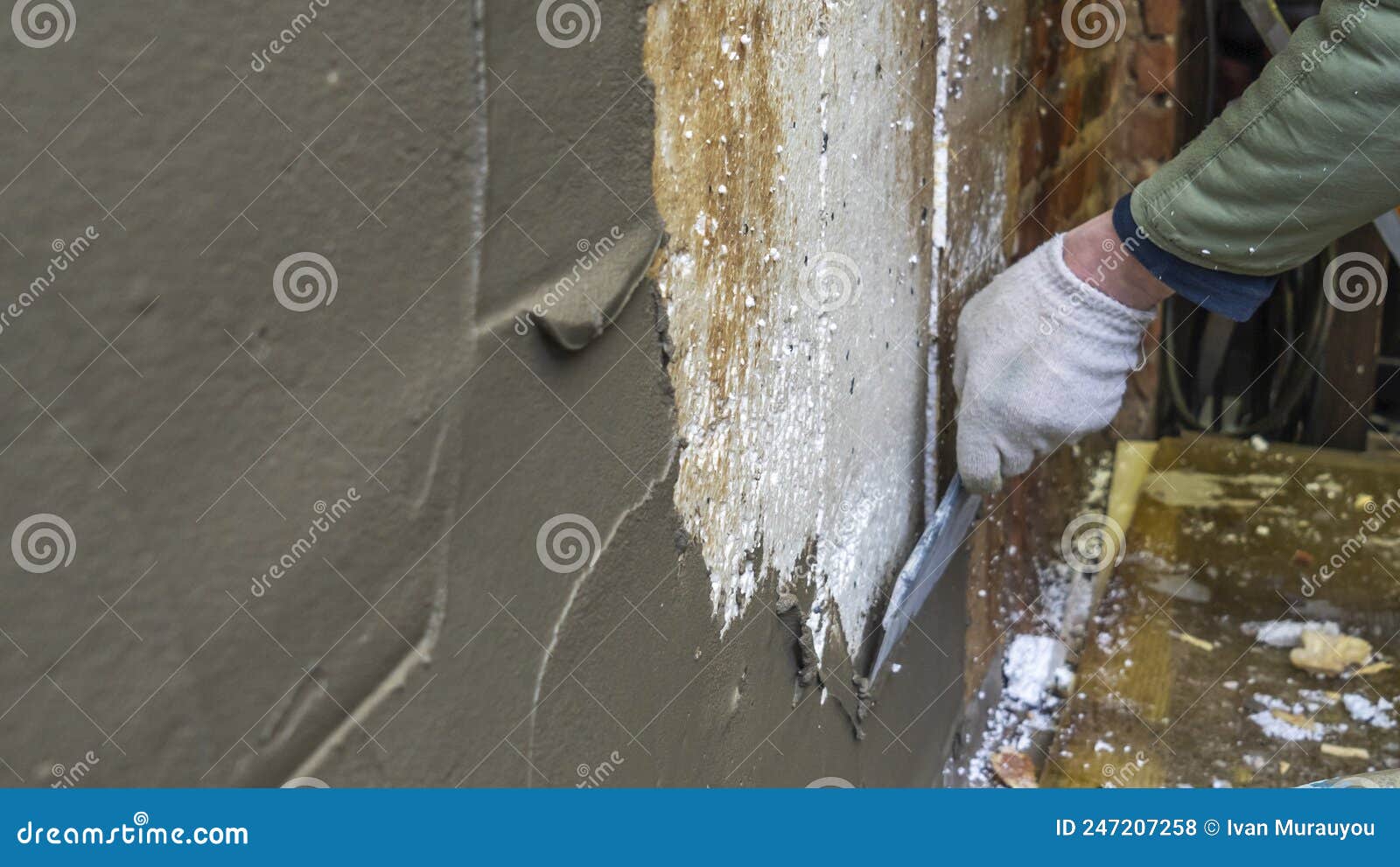 A Plasterer Applies Plaster with a Spatula To a Brick Wall. Wall ...