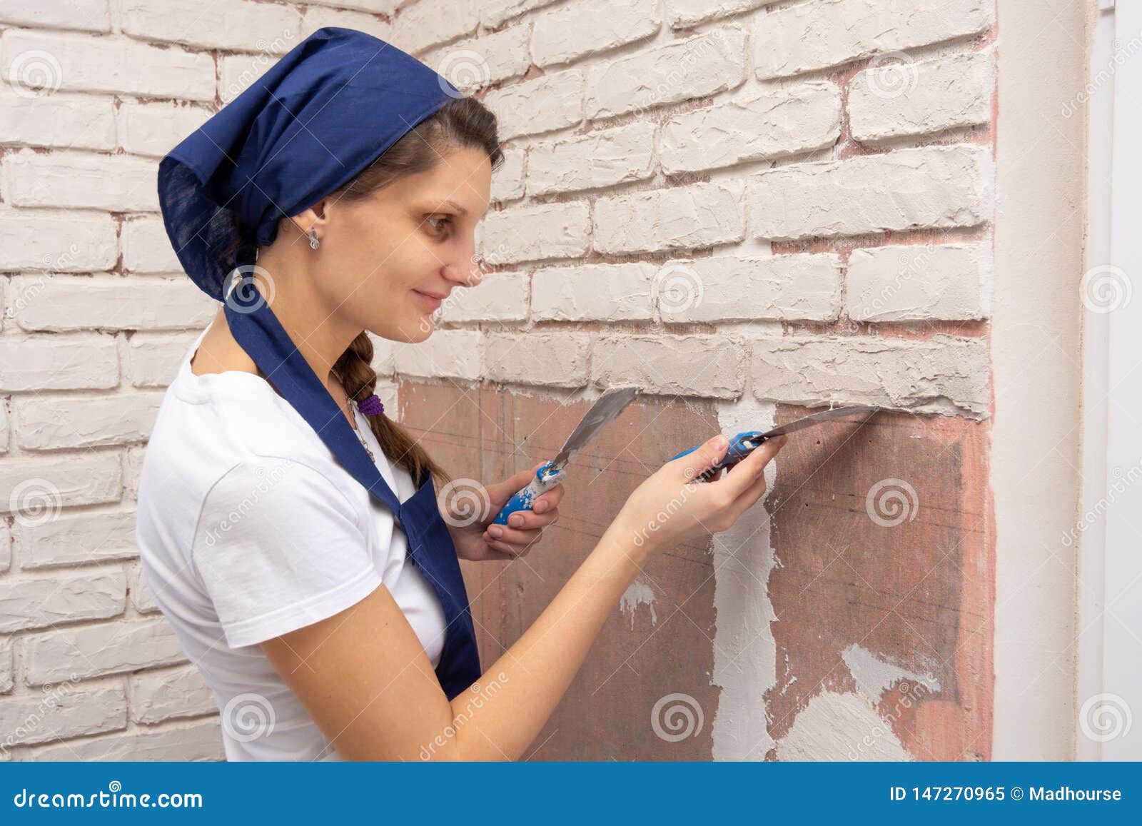 Plasterer Girl Forms from a Plaster Mass Bricks on the Wall Stock Image ...
