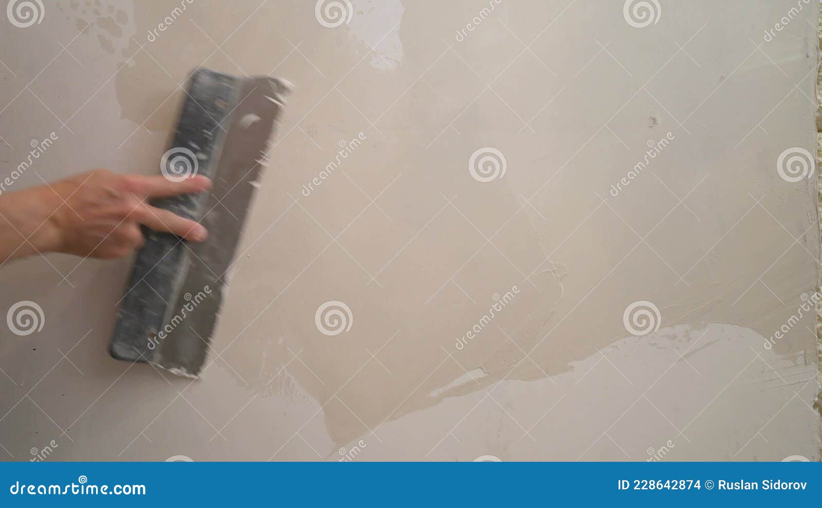 The Plasterer Levels the Wall before Gluing the Wallpaper. the Process ...