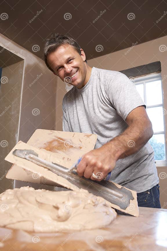Plasterer Mixing Plaster stock image. Image of mixing - 12407693
