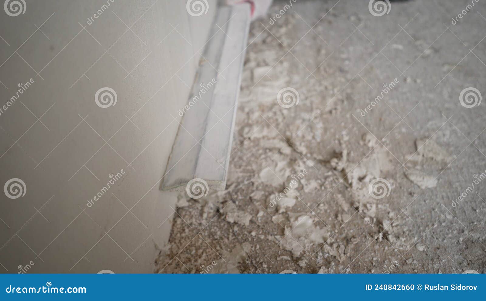 A Plasterer Plasters a Concrete Wall with a Spatula. Worker Aligns Wall ...