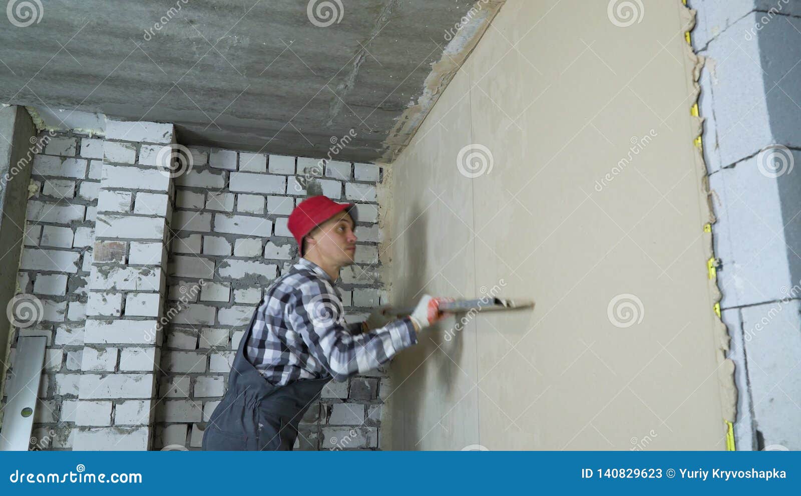 Plasterer Smoothing Plaster on Interior Wall with Construction Ruler ...
