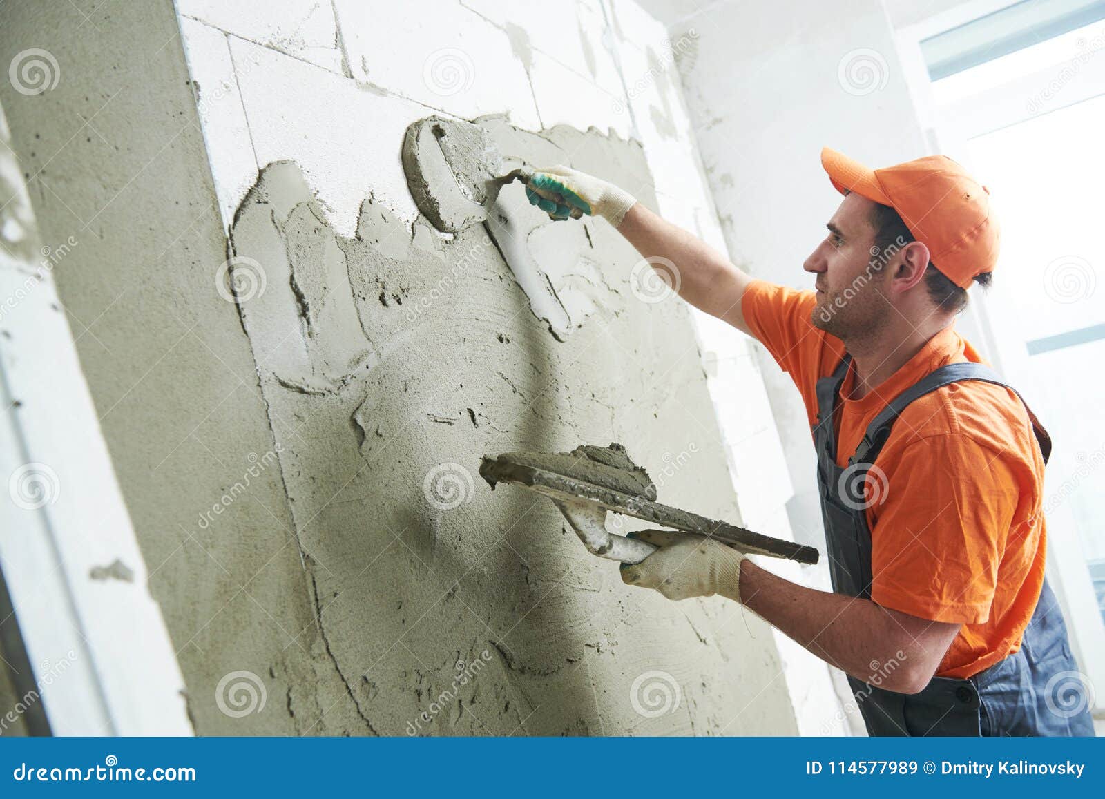 Plasterer Spraying Plastering Mortar On Ceiling With Sprayer Machine ...