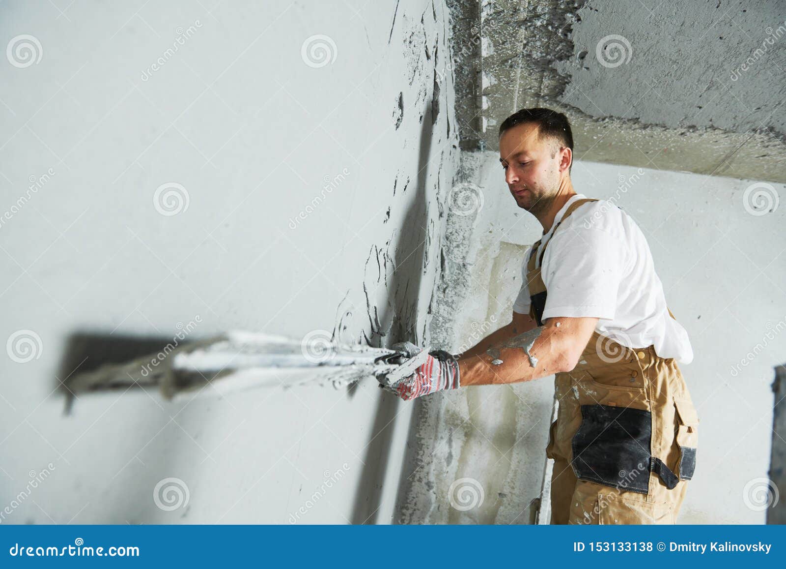 Plasterer Using Screeder Spraying Putty Plaster Mortar on Wall Stock ...