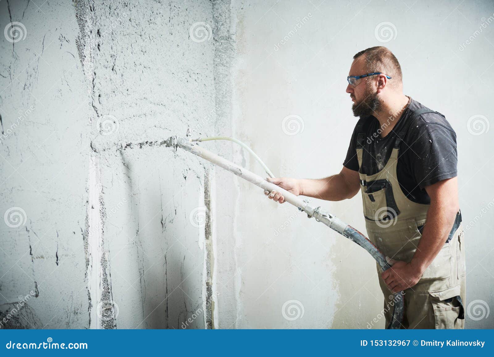 Plasterer Using Screeder Smoothing Putty Plaster Mortar On Wall ...
