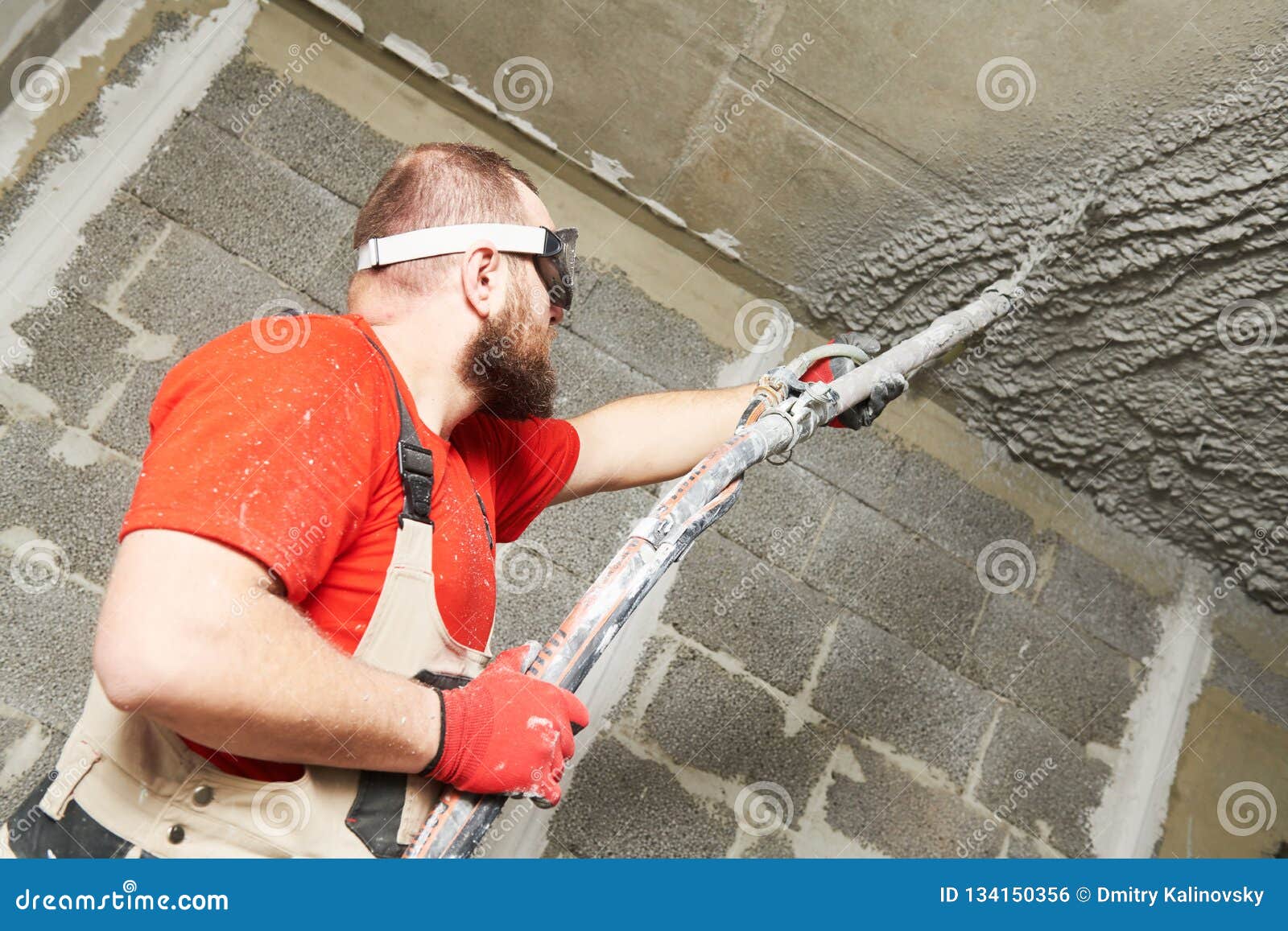 Plasterer Using Sprayer Machine Putting Plaster Mortar on Ceiling Stock ...