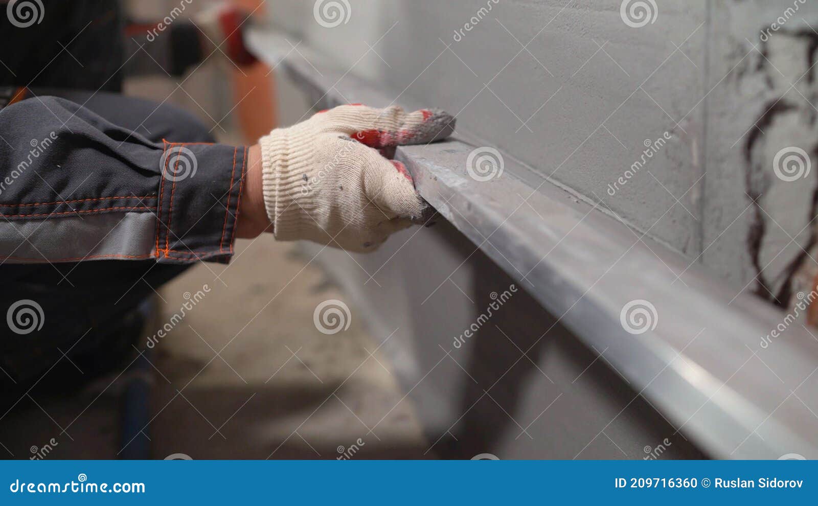 Plasterer at Work on Construction Site, Leveling Walls and Checking ...