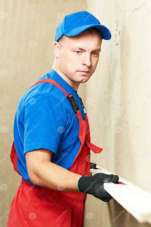 Plasterer at work stock photo. Image of plasterboard - 55440096