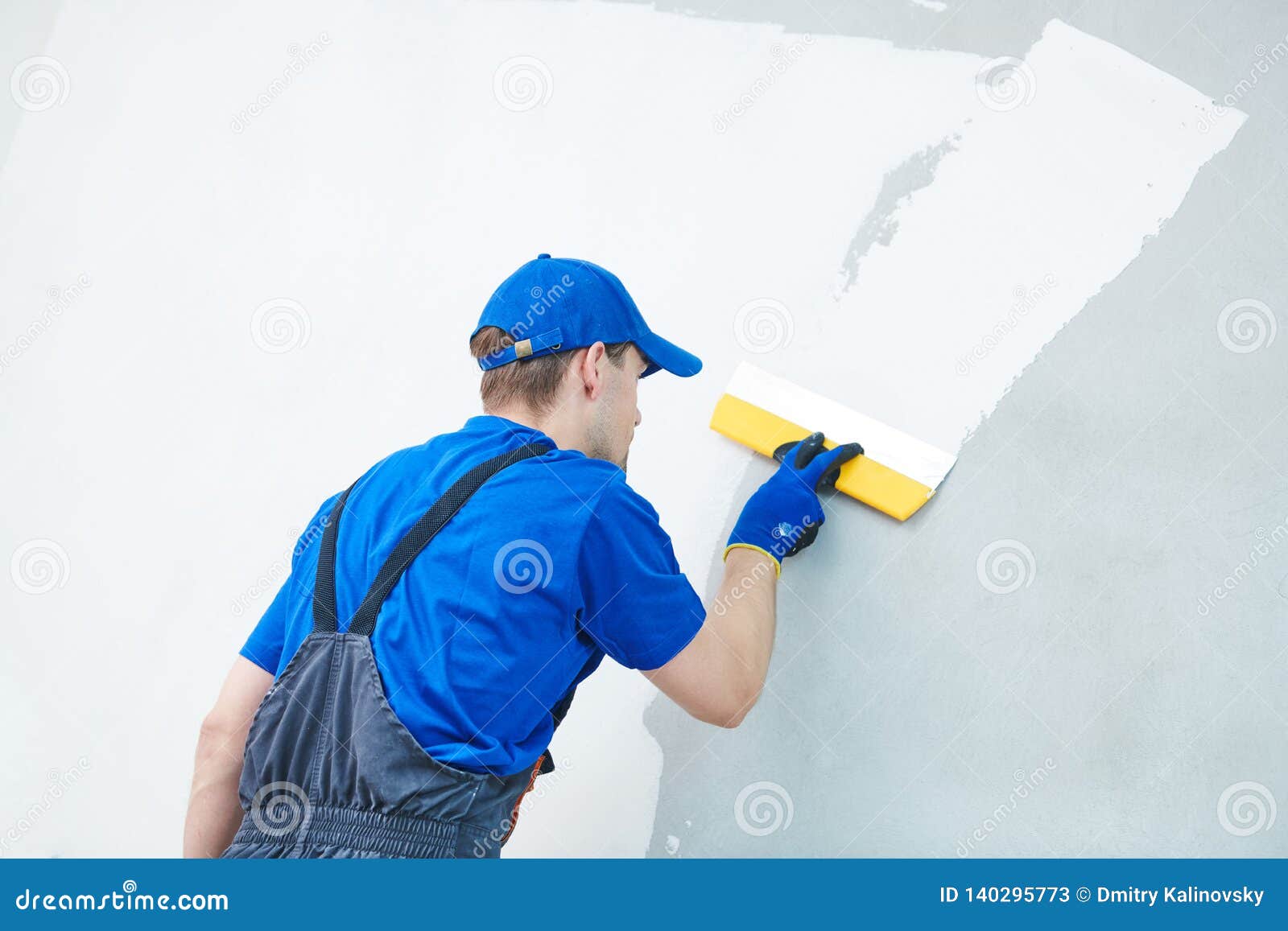 Refurbishment. Plasterer Worker Spackling a Wall with Putty Stock Image ...
