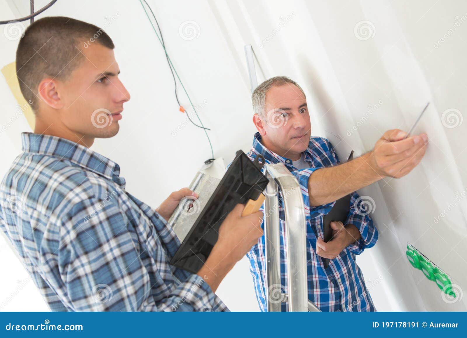 Plastering Apprentice Taking Orders from Teacher Stock Image - Image of ...