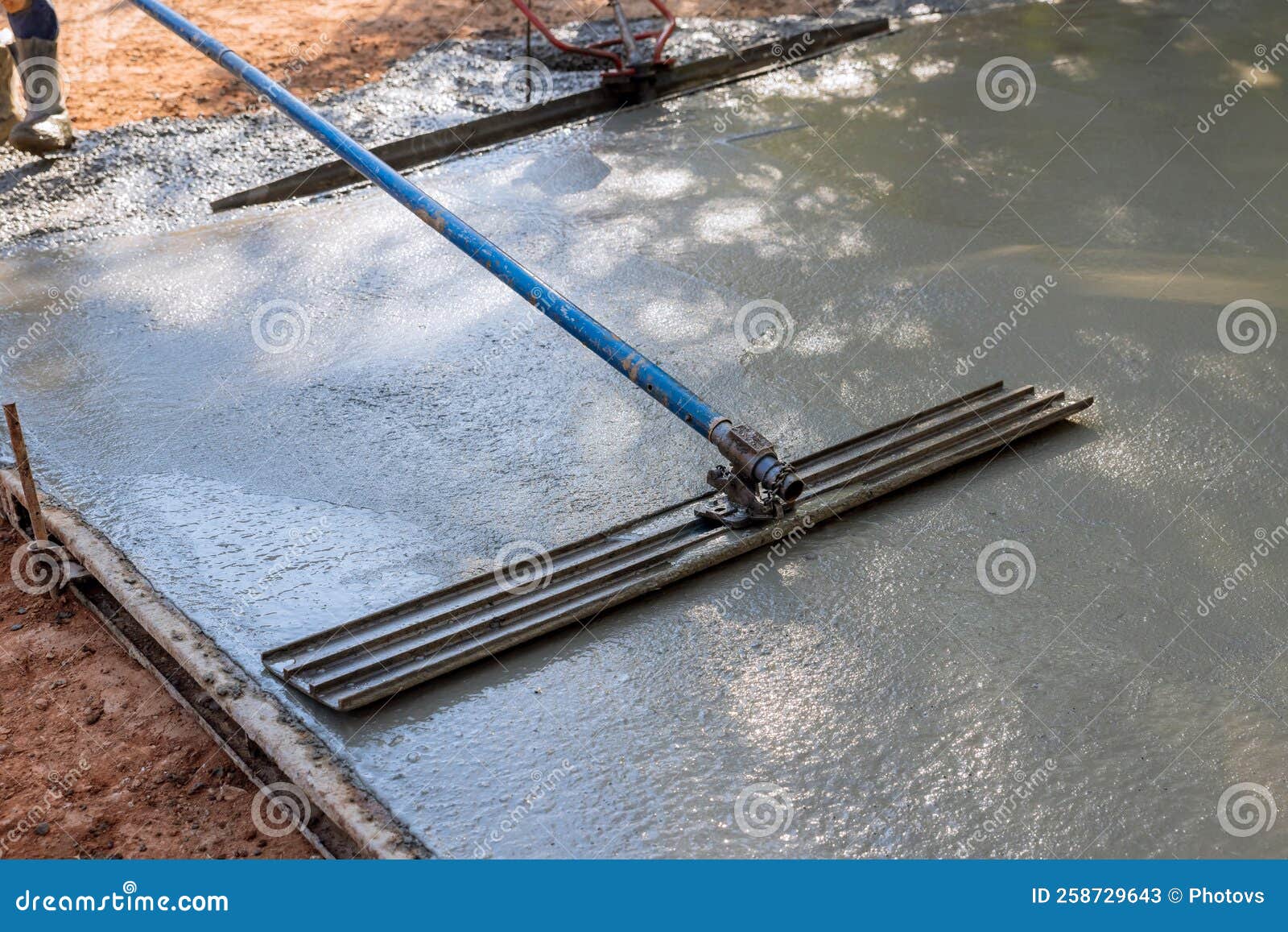 Plastering the Cement Concrete Patio Floor with a Long Trowel Was Done ...