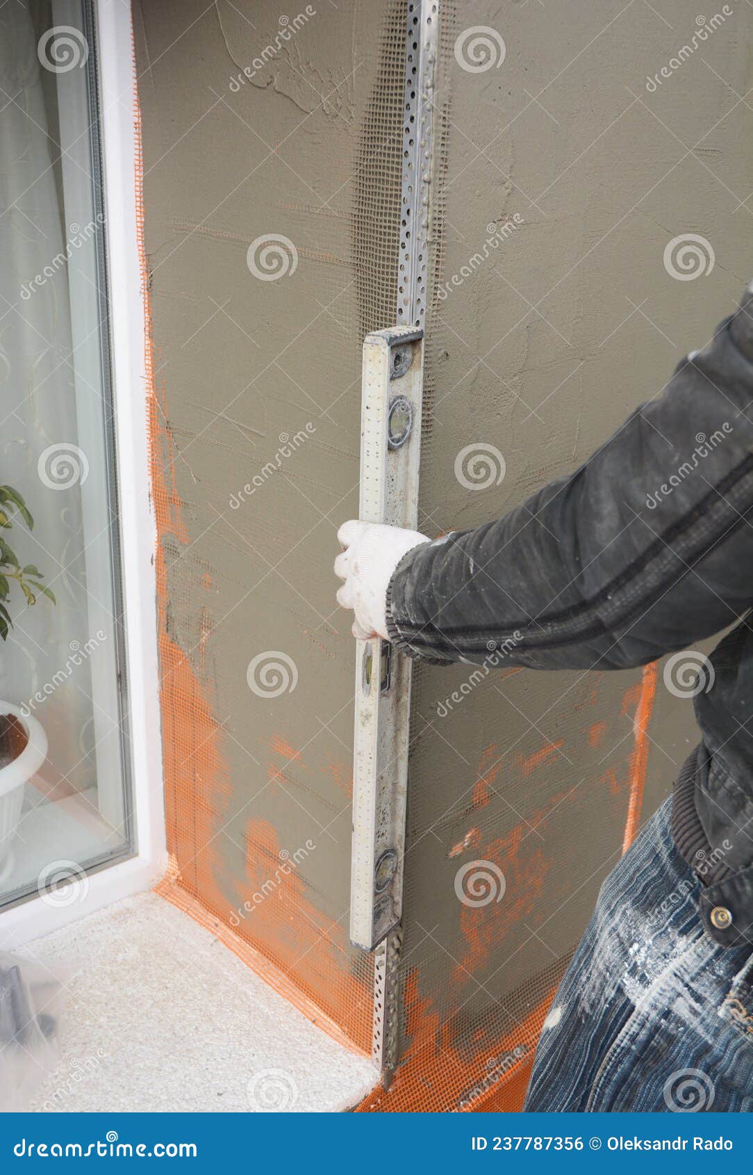Plastering External Window Corners: a Building Contractor is Plastering ...