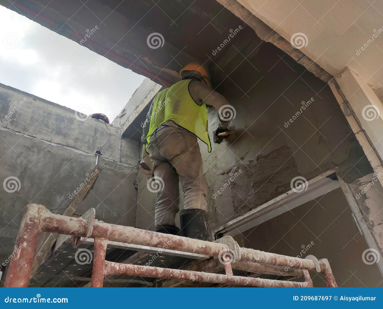 Plastering Work by Construction Workers Using the Cement Plaster ...