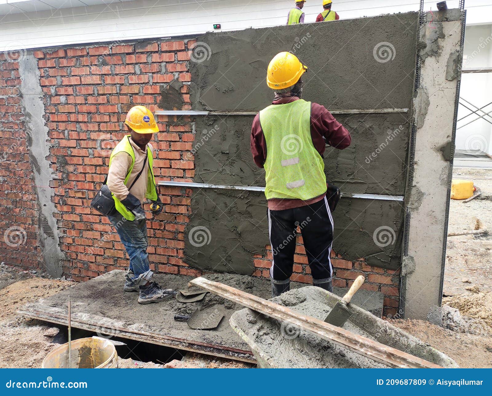 Plastering Work by Construction Workers Using the Cement Plaster ...
