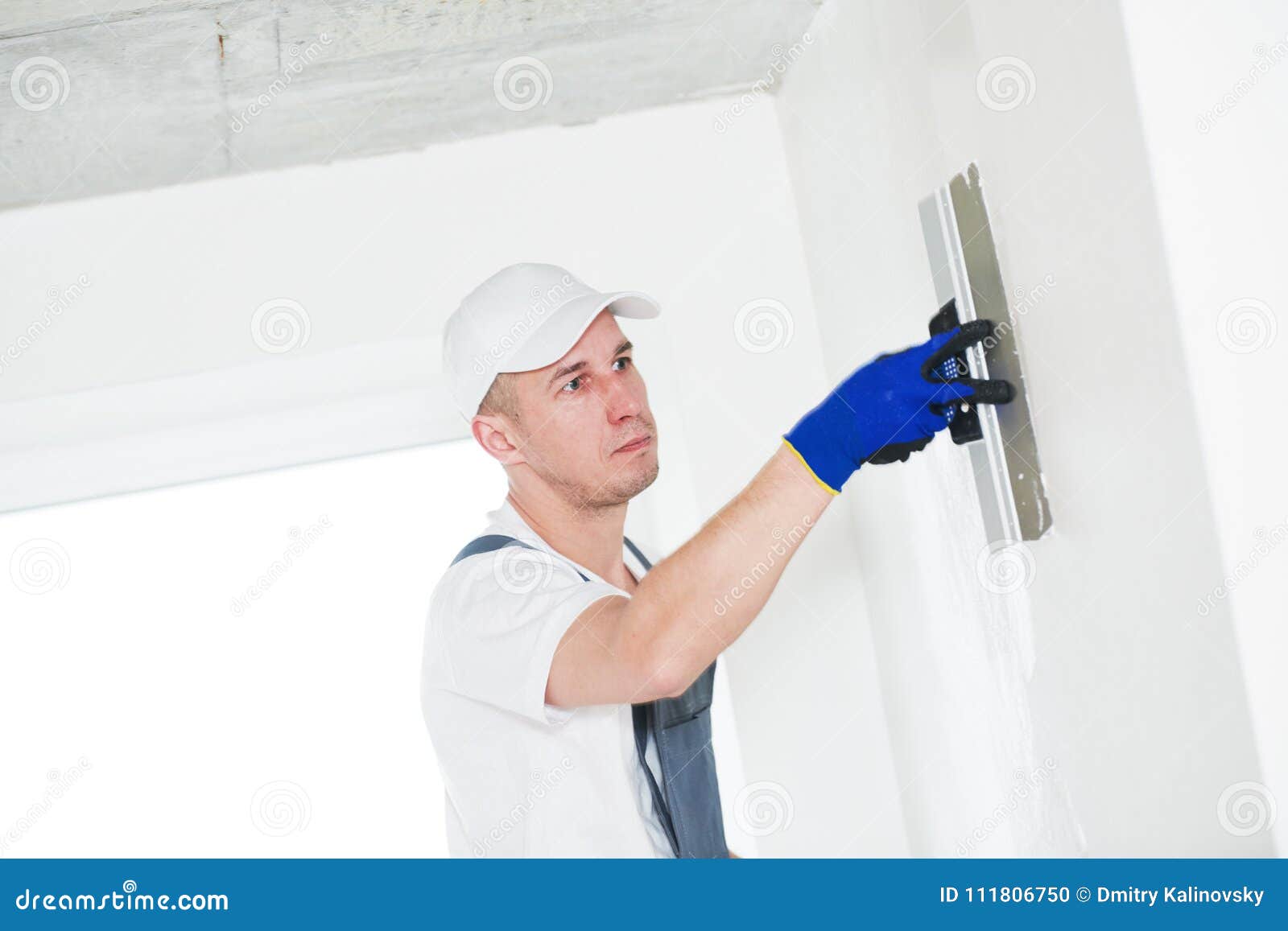 Plastering. Worker Spackling a Wall with Putty Stock Photo - Image of ...