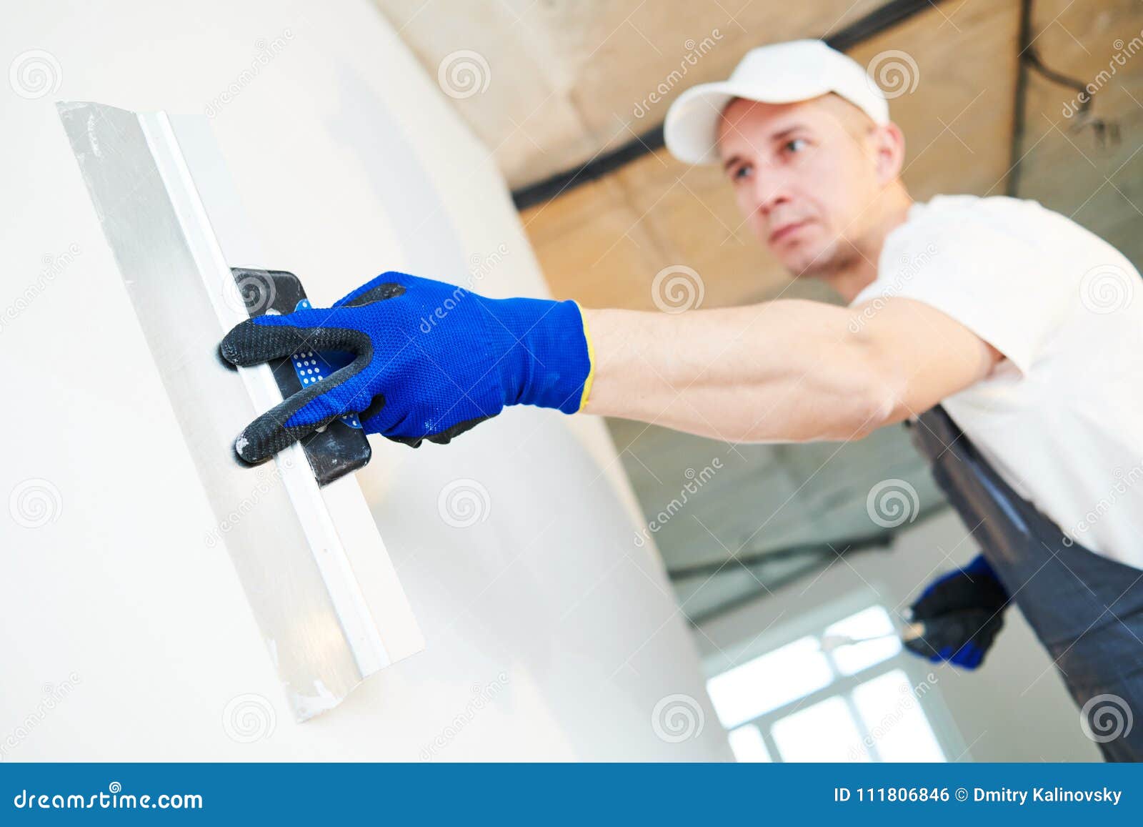 Plastering. Worker Spackling a Wall with Putty Stock Photo - Image of ...