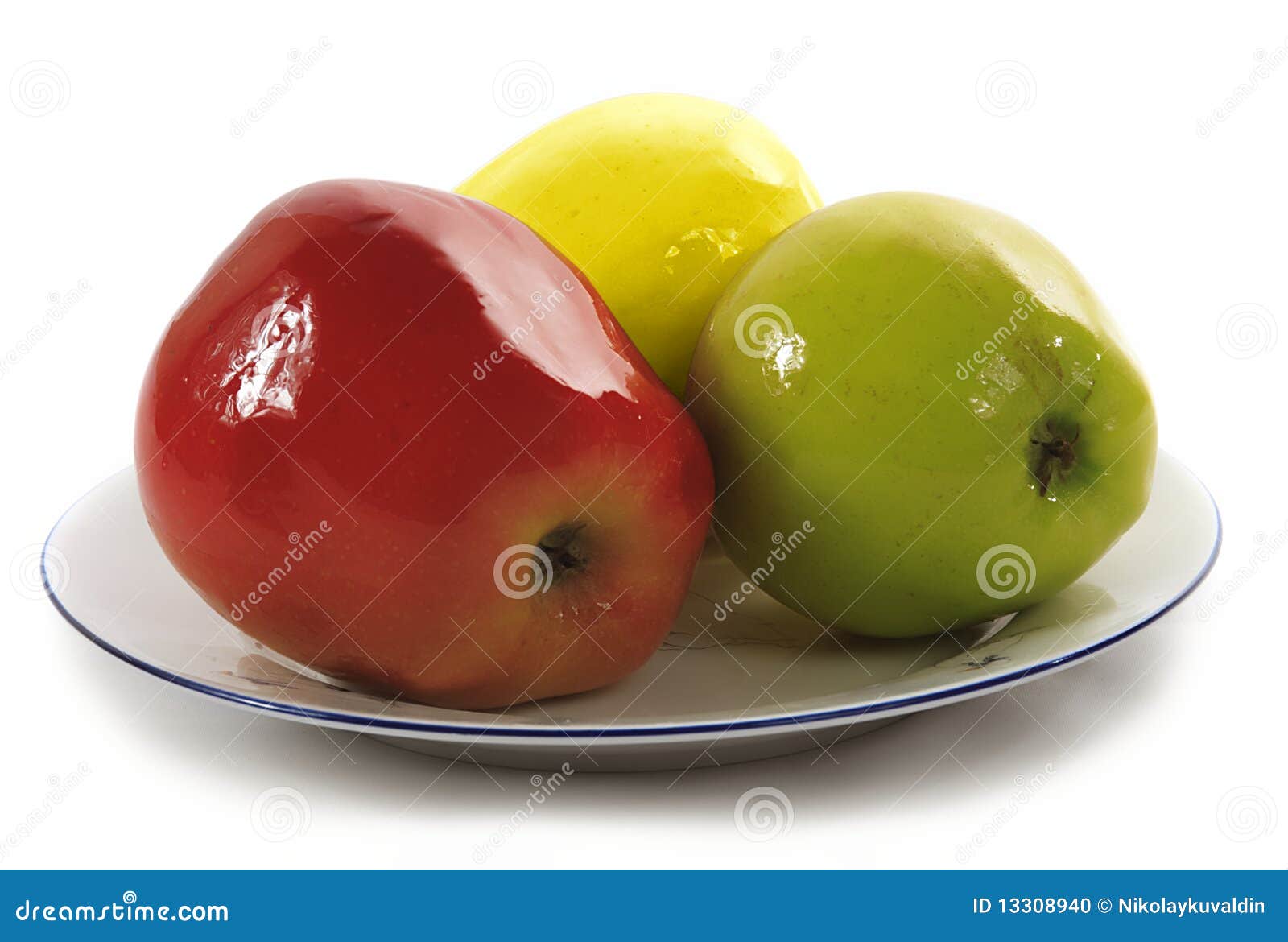 Plastic apples on a plate stock photo. Image of background - 13308940