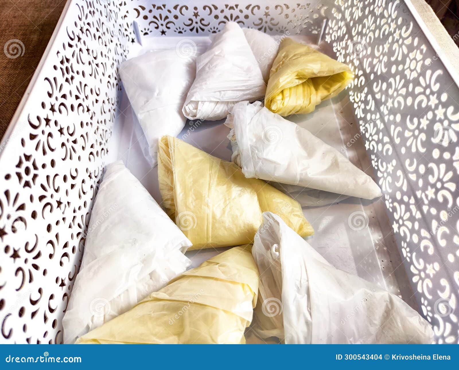 Plastic Bag Folded into a Triangle for Storage. Ways of Storing and ...