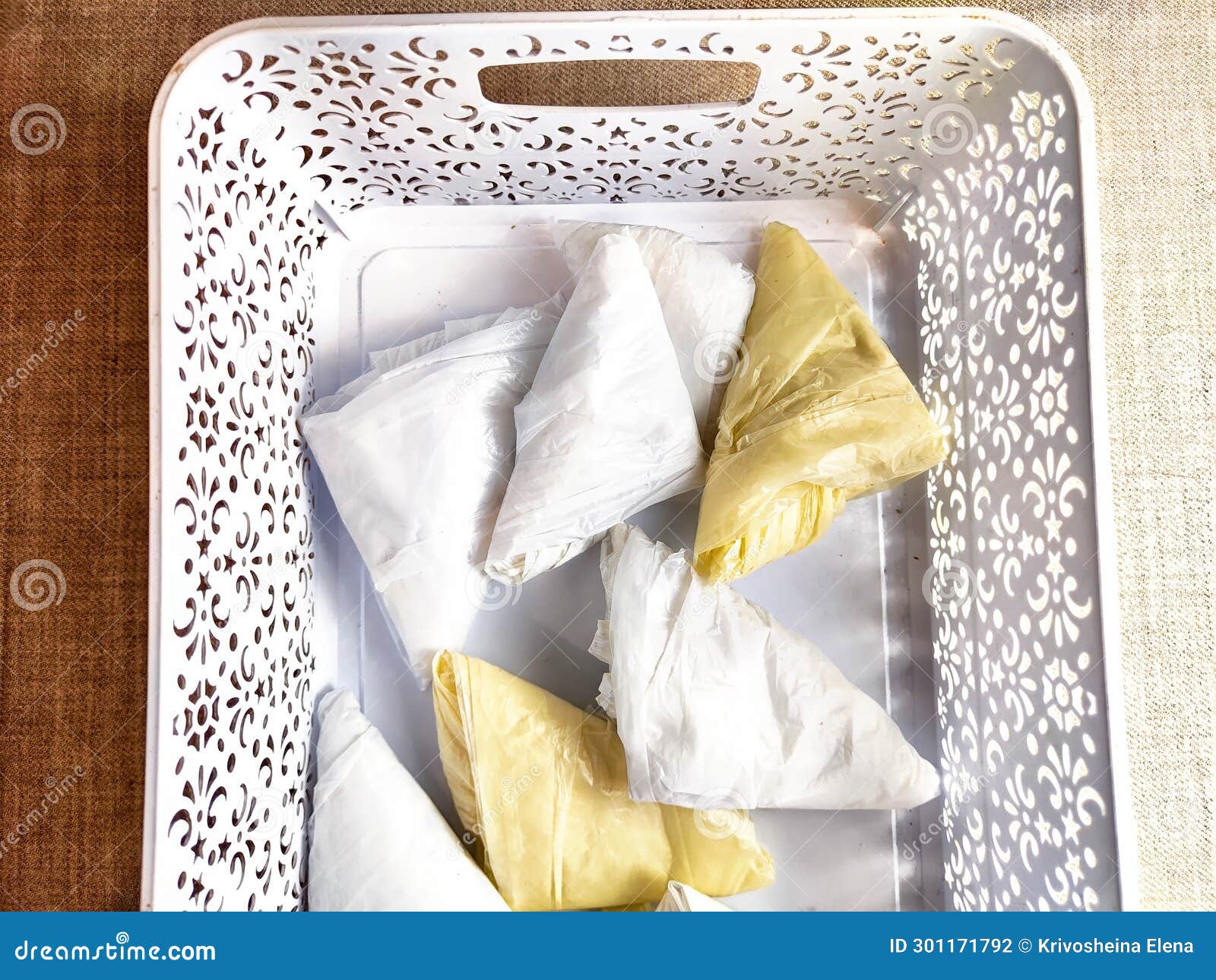 Plastic Bag Folded into a Triangle for Storage. Ways of Storing and ...