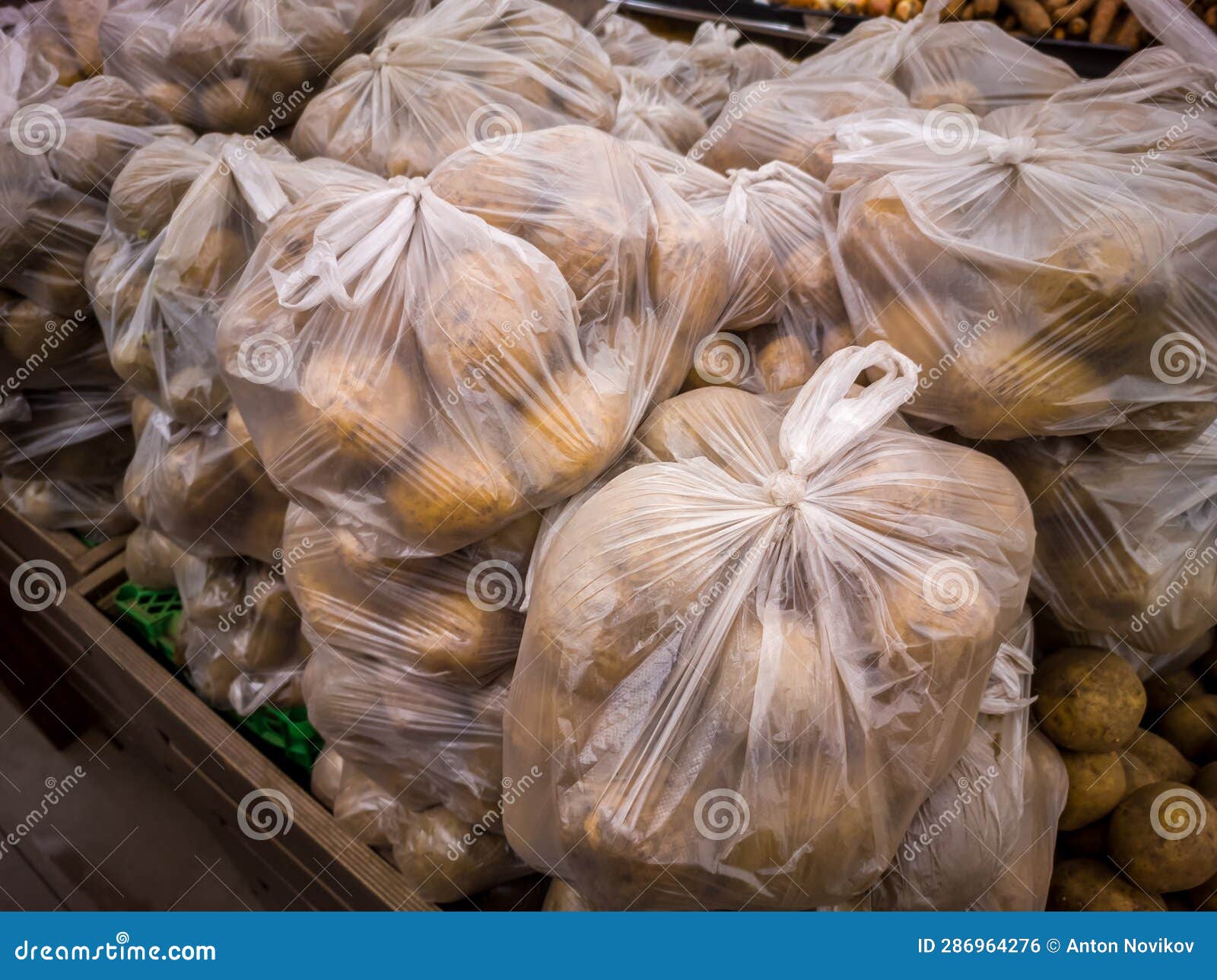 Plastic bags with potatoes stock photo. Image of fresh - 286964276