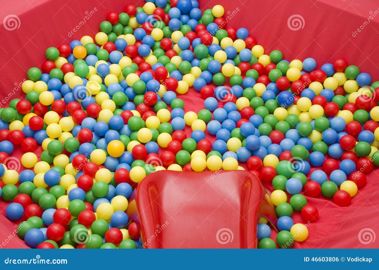 Plastic balls in red pool stock photo. Image of slide - 46603806