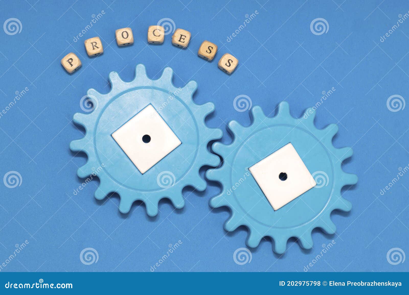Plastic Blue Gears on a Blue Background, the Word Process. the Concept ...
