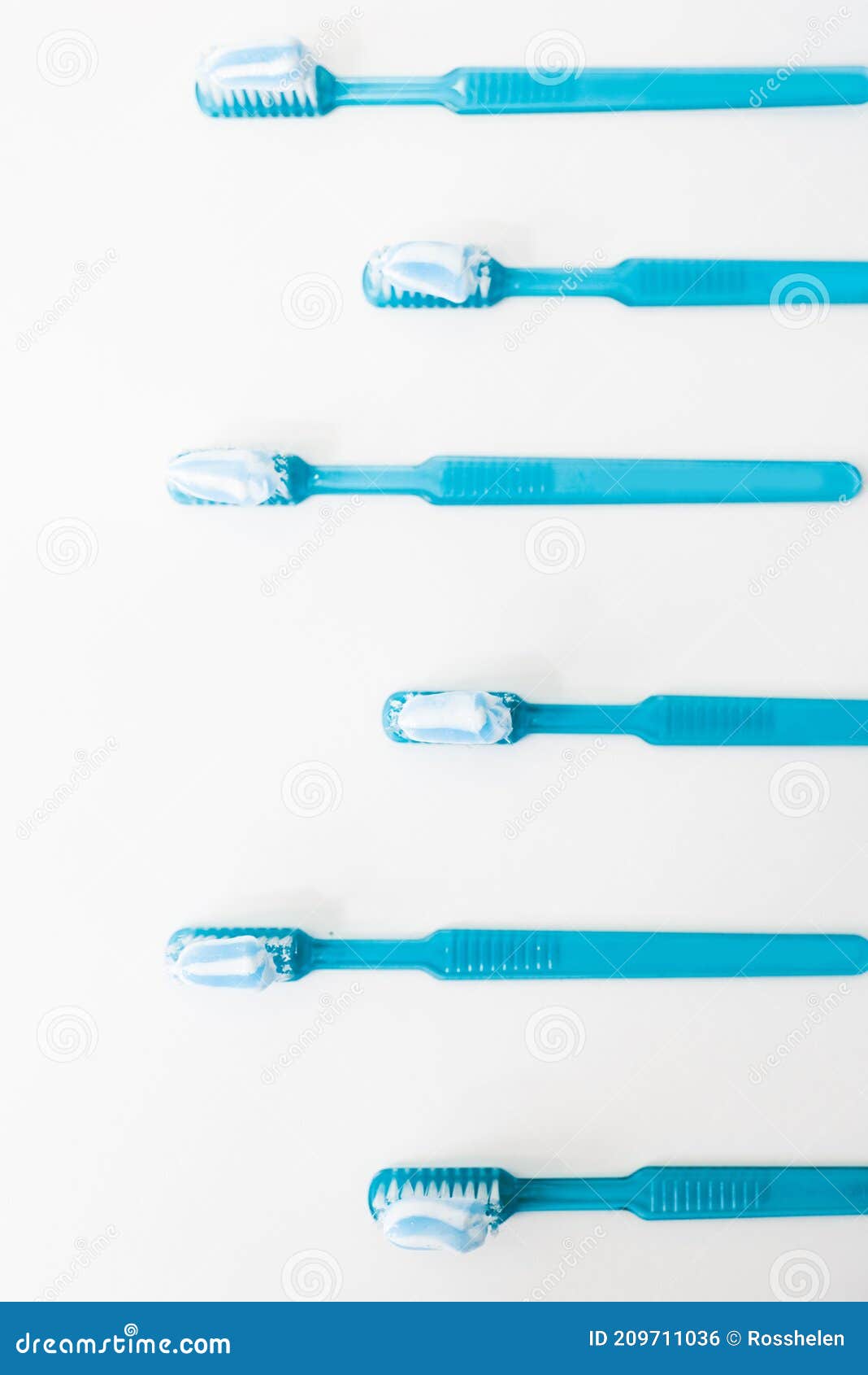 Plastic Blue Toothbrushes with Toothpaste Isolated on a White ...