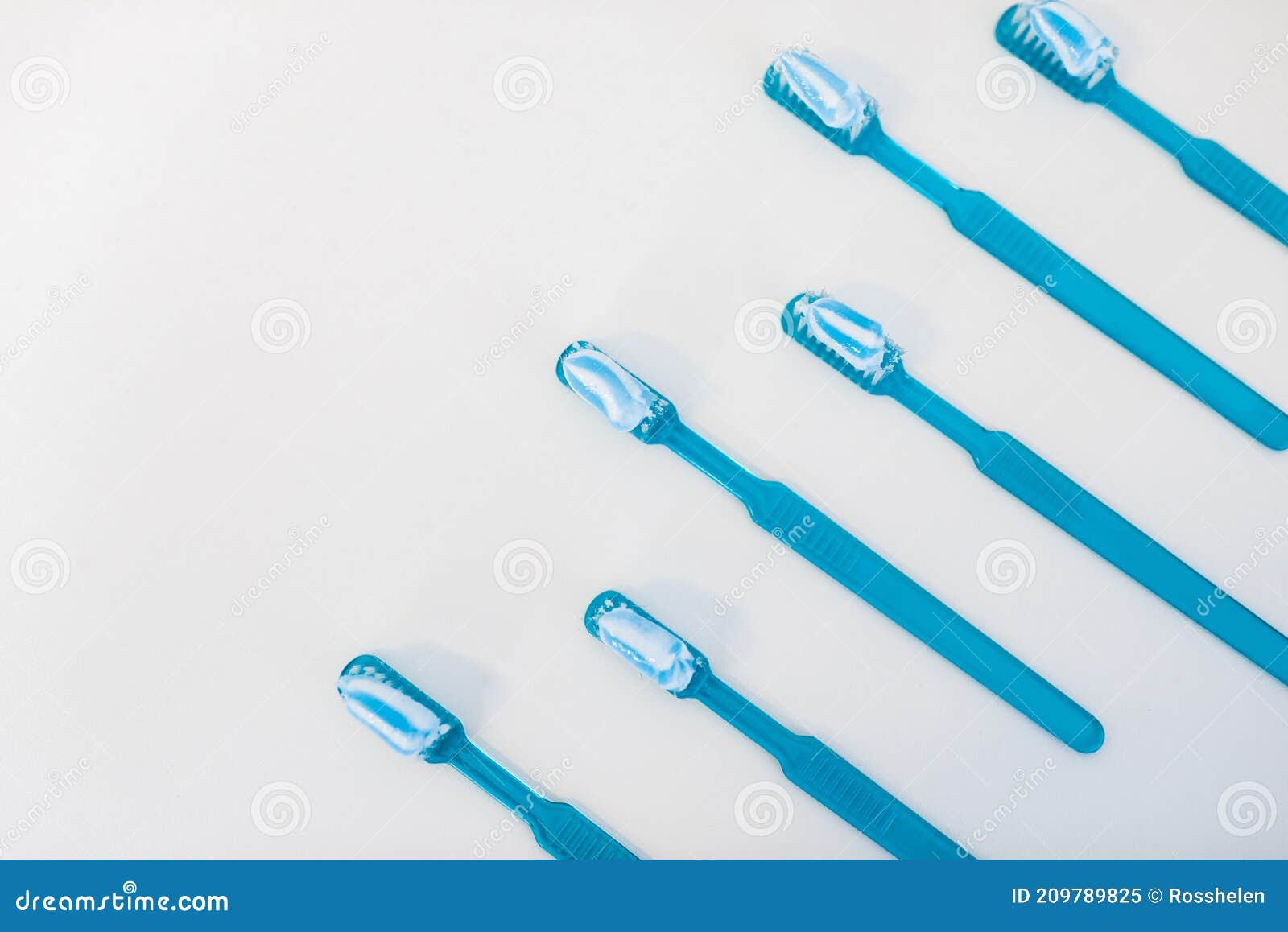 Plastic Blue Toothbrushes with Toothpaste Isolated on a White ...