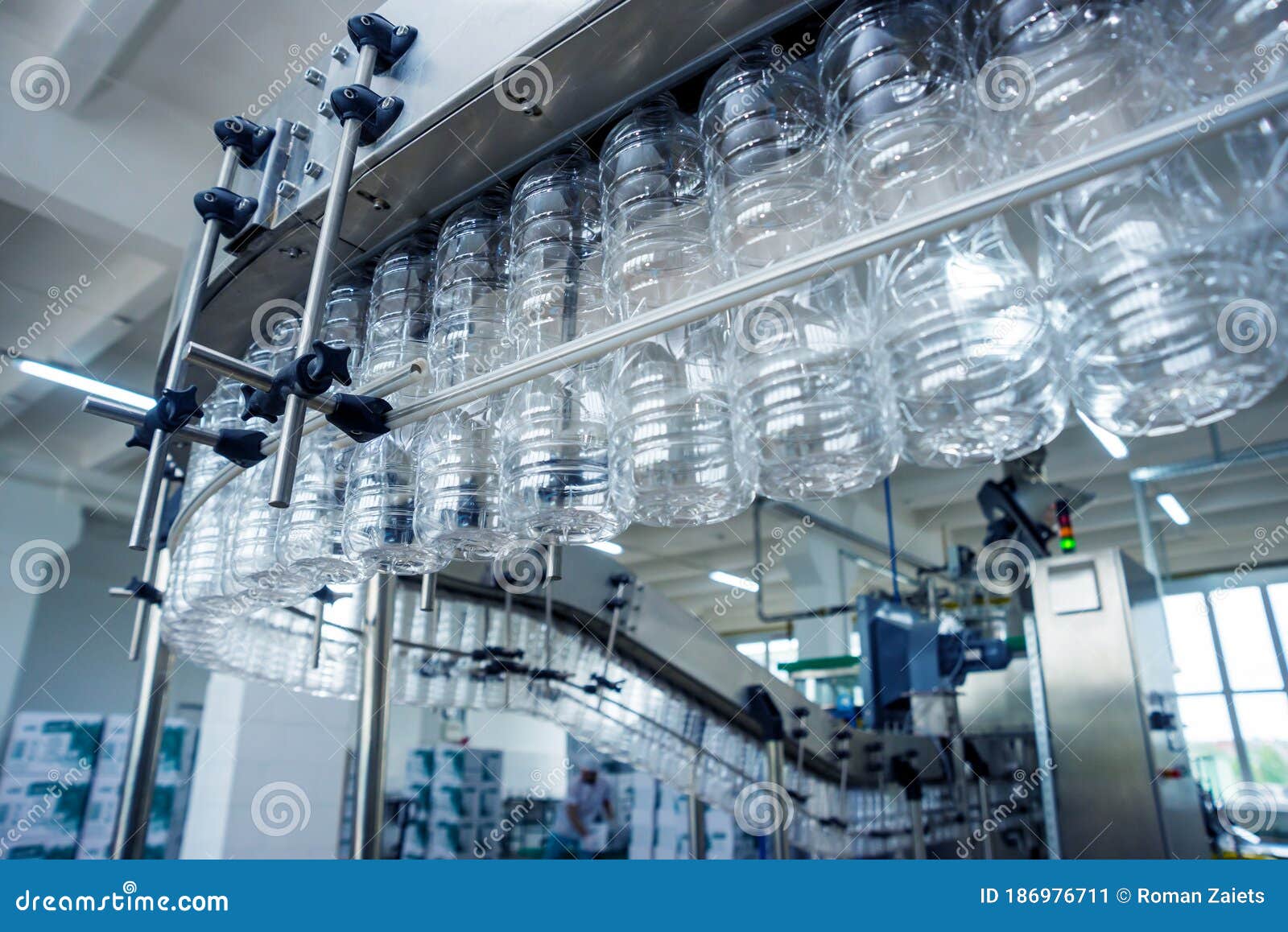 The Plastic Bottle Blowing Machine. PET Preforms for Blowing of Plastic ...