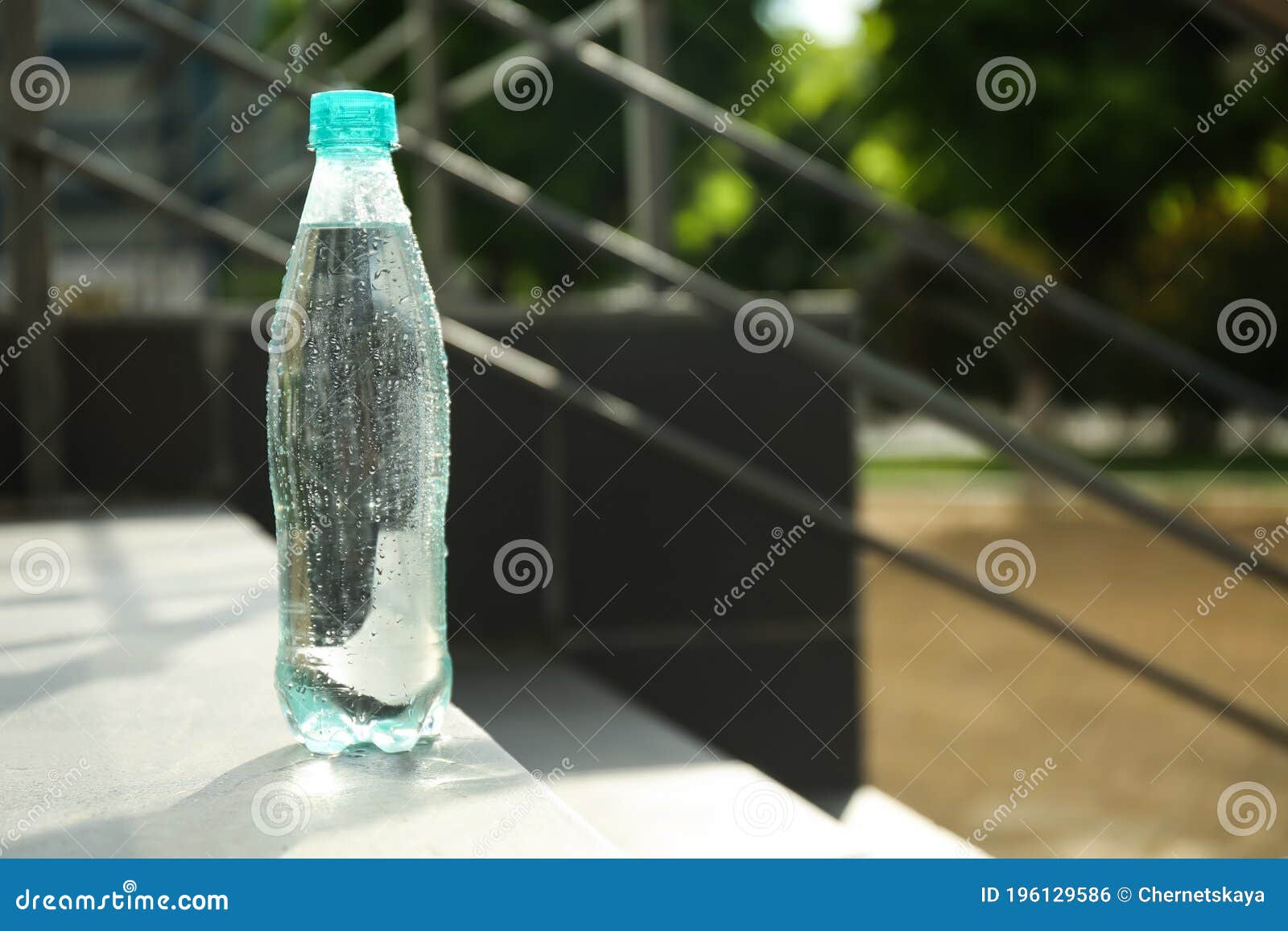 Plastic Bottle Of Cold Pure Water Outdoors. Space For Text Stock ...